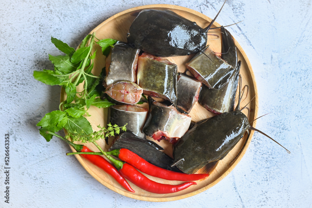 catfish for cooking food, fish chopped with ingredients herb and spices ...