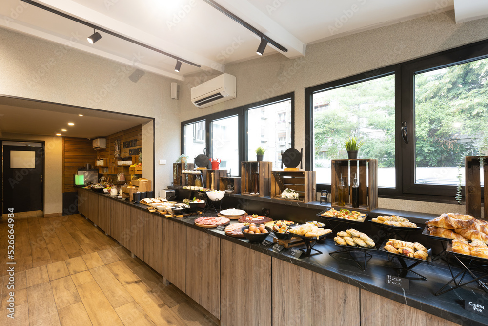 Interior of a hotel restaurant with buffet table Stock Photo | Adobe Stock