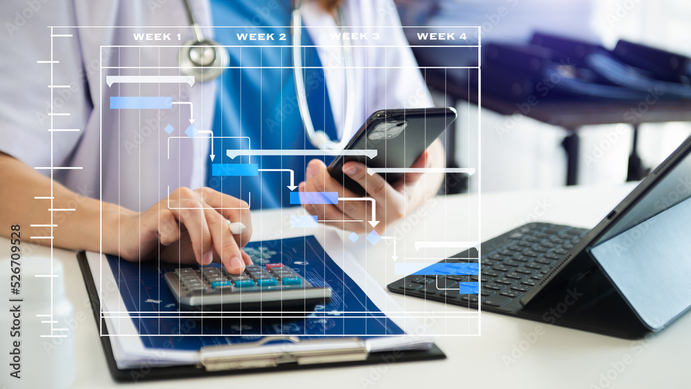 Zdjęcie Stock: Project manager working and update tasks with Gantt ...