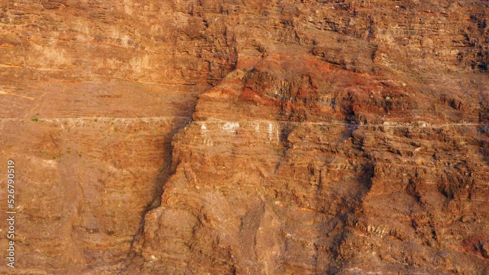 Close up of high rock steep cliff. Sunrise light reflect landscape on ...