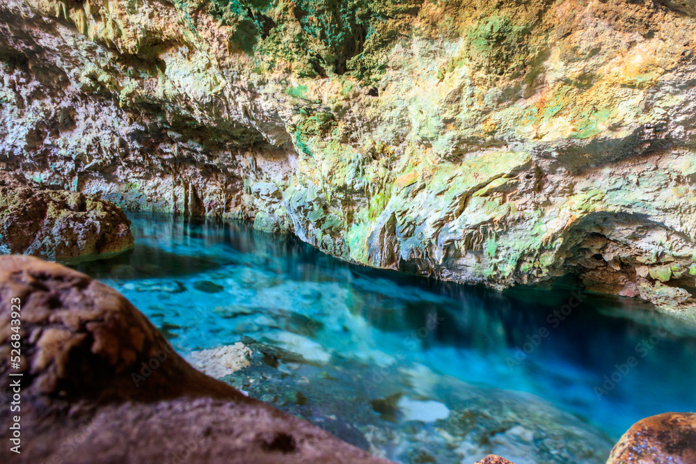 View of beautiful natural pool of crystal clear water formed in a rocky ...