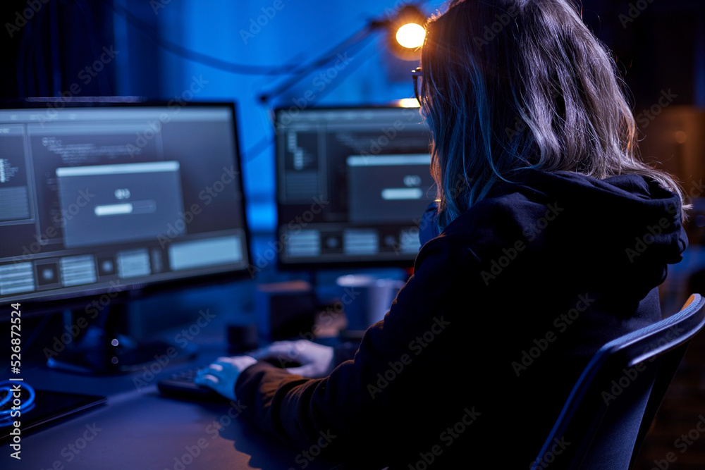 Cybercrime Hacking And Technology Concept Hacker In Dark Room Writing Code Or Using Computer