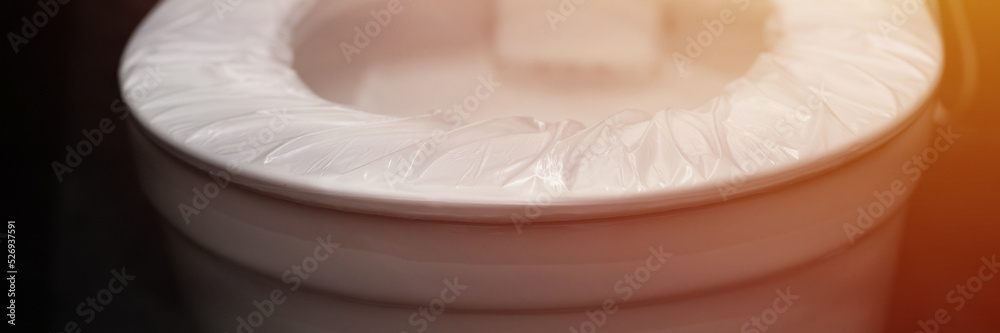 disposable cover pad on the rim of the toilet seat. wc hygiene system ...