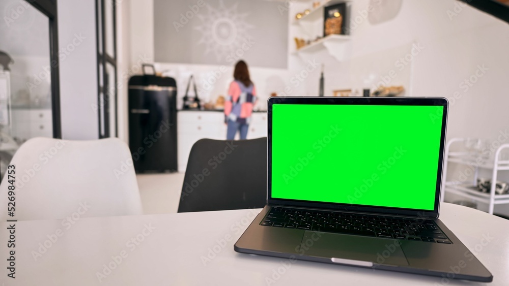 Closeup of notebook with green screen chroma key background on table ...