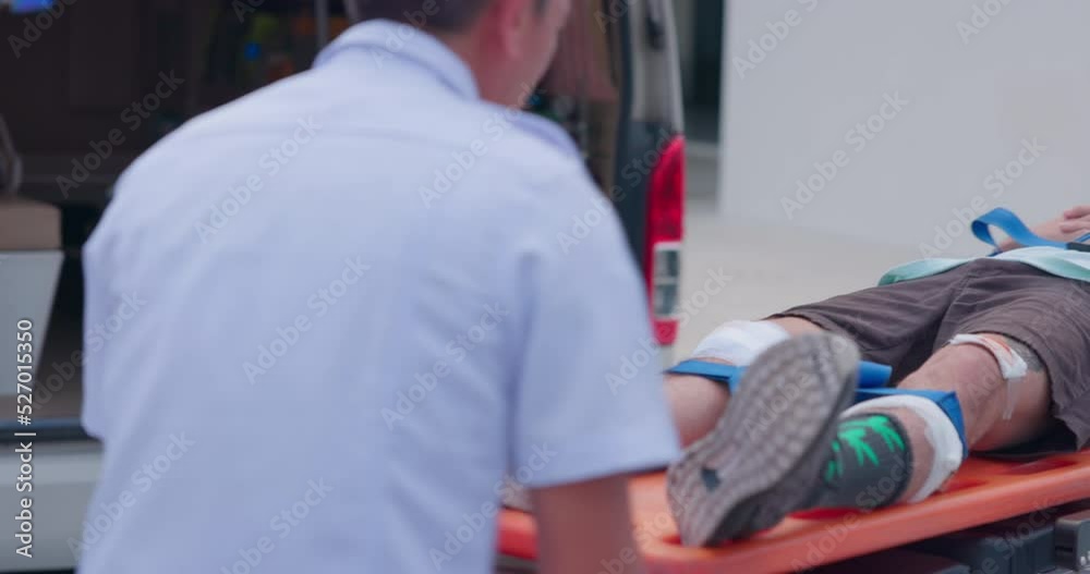 A team of EMS paramedics responds quickly to transport an injured ...