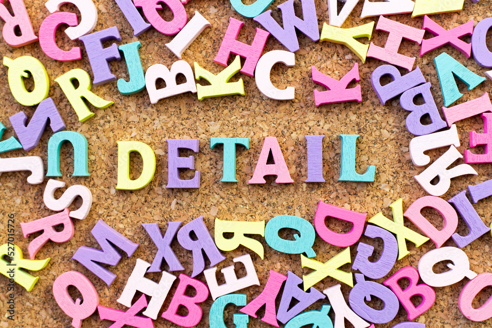 Color alphabet in word detail with another letter as frame on cork ...