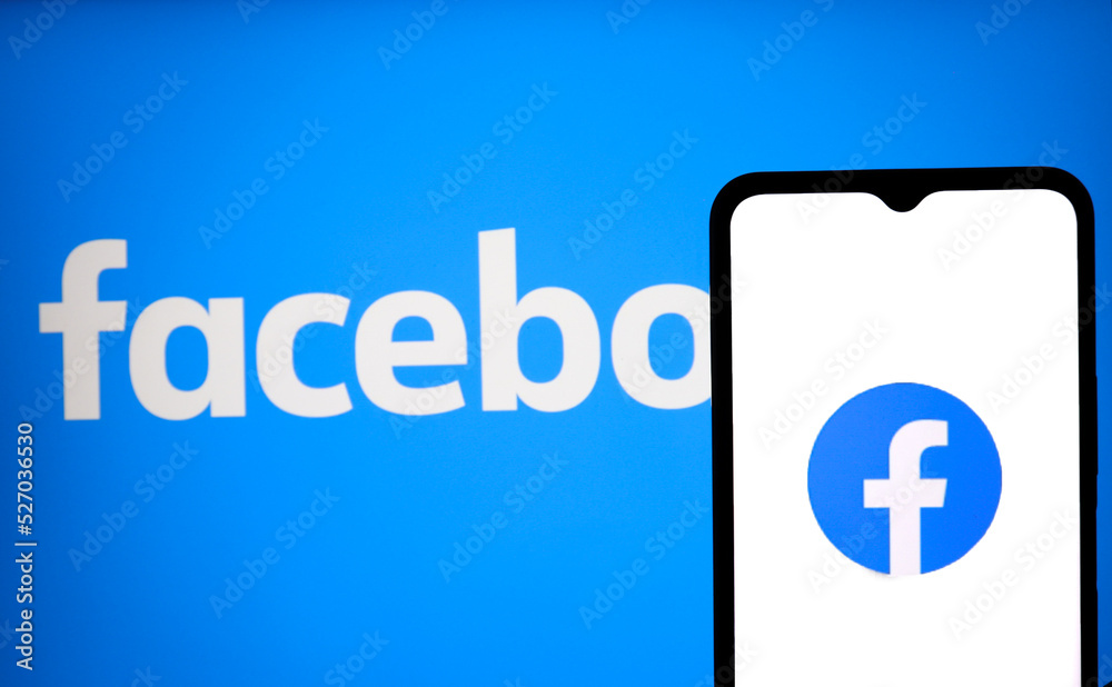 Facebook logo on the smartphone screen and Facebook logo background ...
