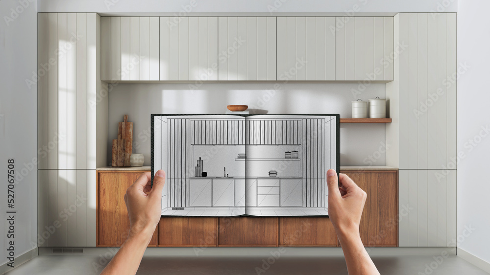 Hands holding notepad with cozy wooden kitchen design blueprint sketch ...