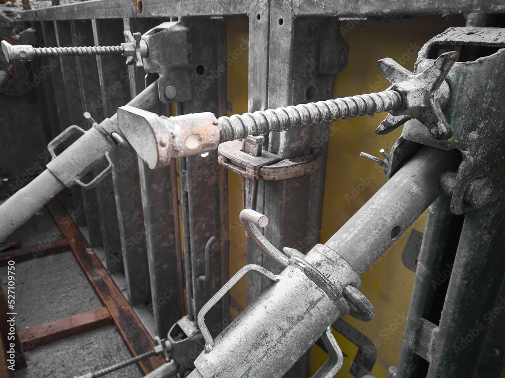 Cast-in-place concrete works. Scaffolding structures. Metal props hold ...
