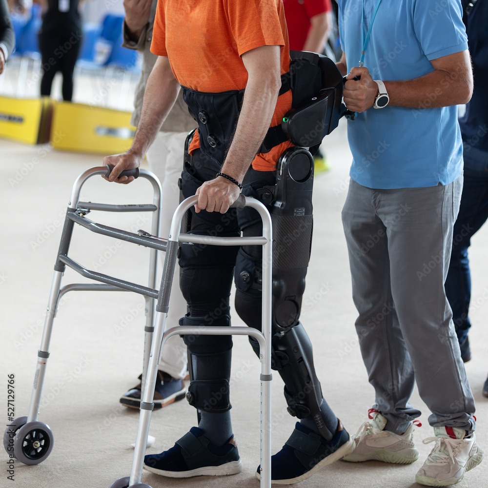 Boy with Mobility Problems in Lower Limbs in Upright Posture Walking ...