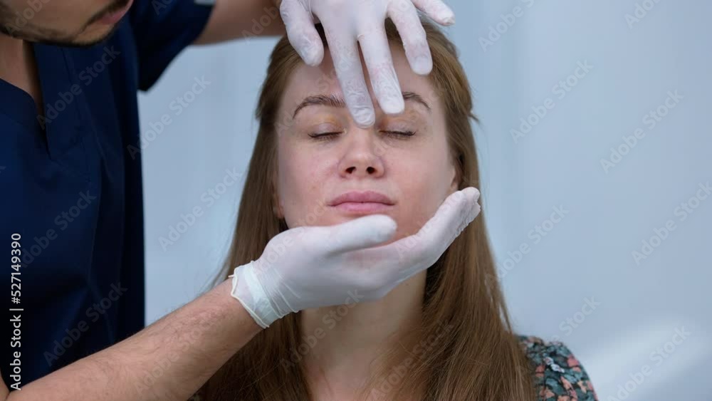 Portrait of concentrated woman posing in plastic surgery clinic as ...