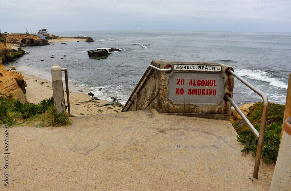 Shell Beach sign by entrance stairs in La Jolla Beach in California. No ...