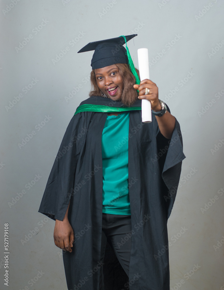 Portrait of African female student or graduand from Nigeria, wearing ...