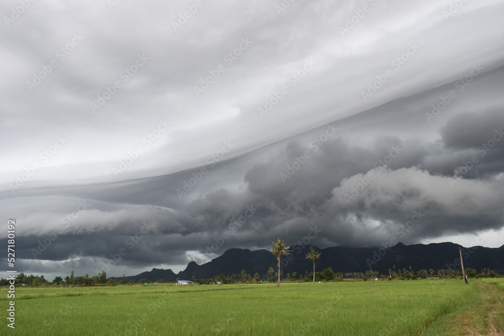 Gray Cumulonimbus cloud formations on sky above mountain, Nimbus moving ...