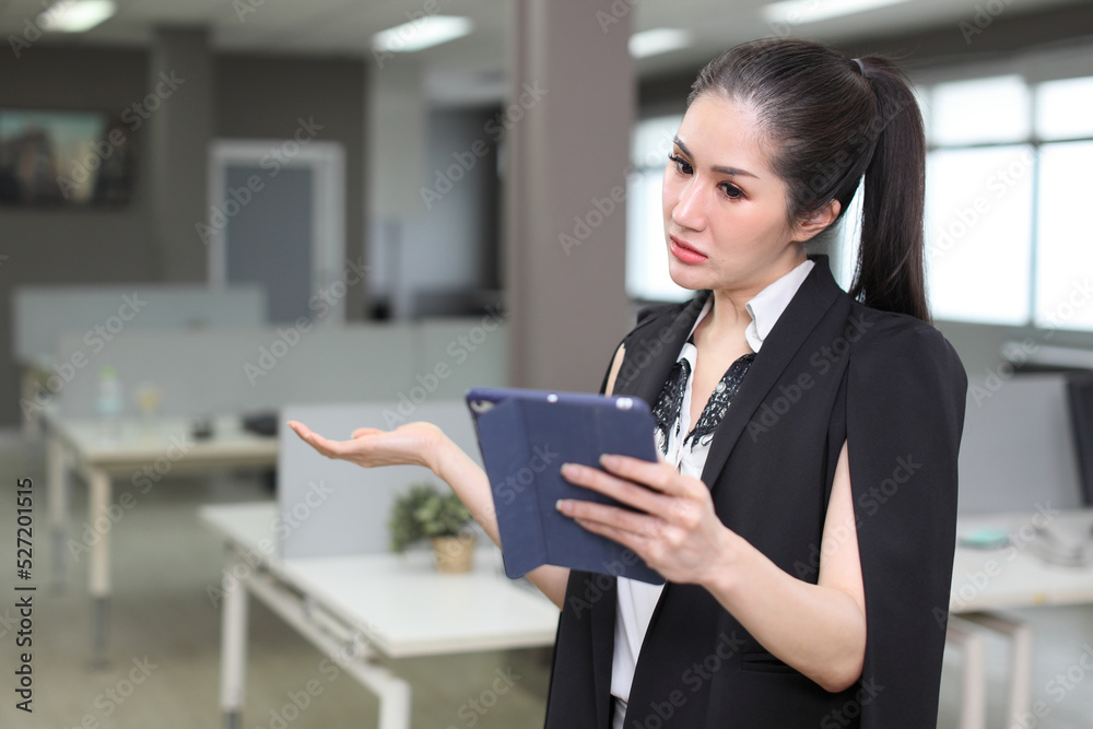 Adult asian businesswoman standing and touching her head after bad news ...
