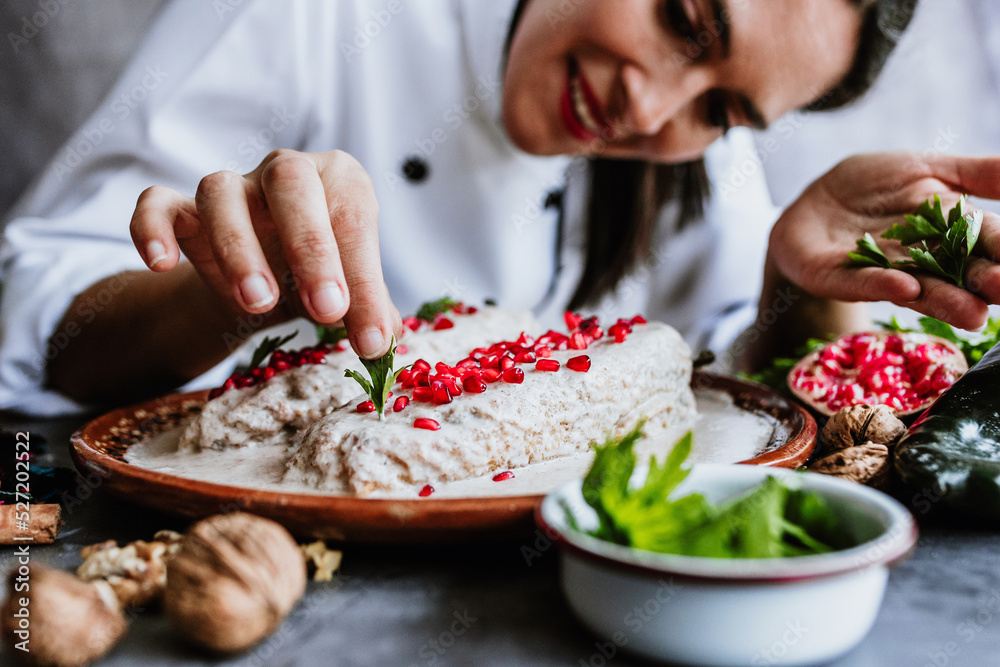 mexican woman chef cooking chiles en nogada recipe with Poblano chili ...