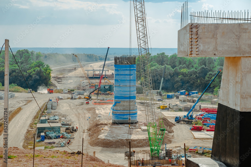 Constructing concrete pillars of the bridge. Construction of the new ...