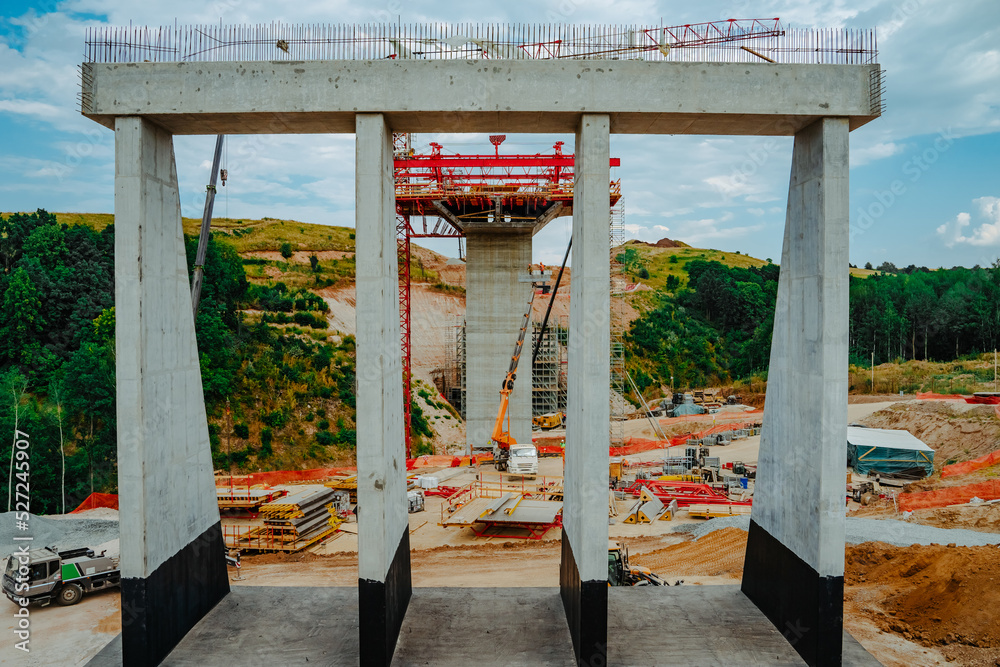 Constructing concrete pillars of the bridge. Construction of the new ...