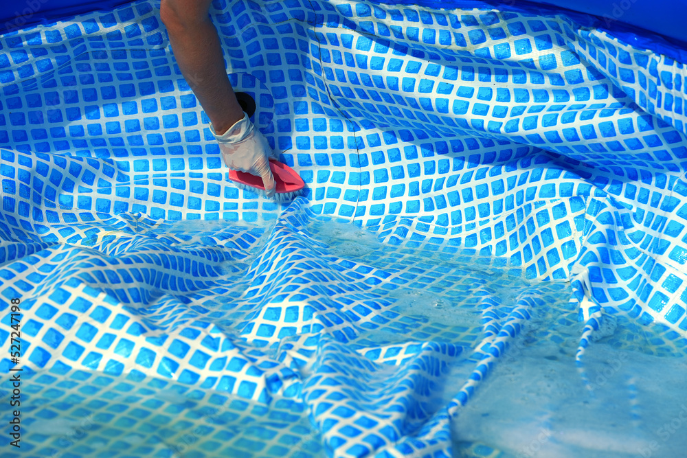 Cleaning pvc inflatable swimming pool, Cleaning the dirty empty pool of ...