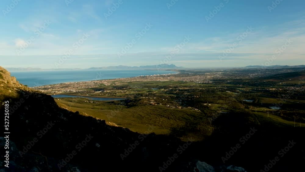Sunrise elevated pan at Sir Lowry's Pass lookout, False Bay and Strand ...