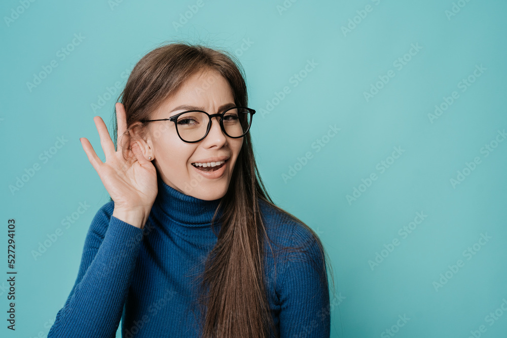 I can’t hear you! Pretty caucasian young female in glasses holding hand ...