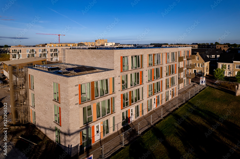 Final construction phase showing exterior facade aerial of real estate ...