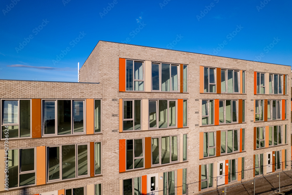 Final construction phase showing exterior facade aerial of real estate ...
