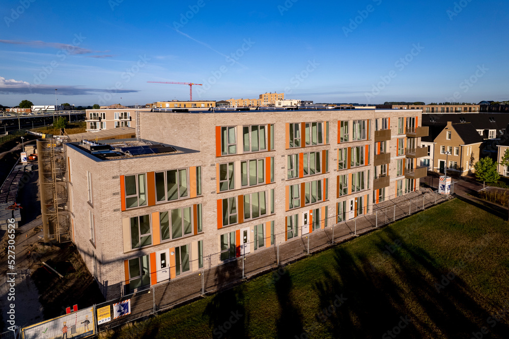 Final construction phase showing exterior facade aerial of real estate ...