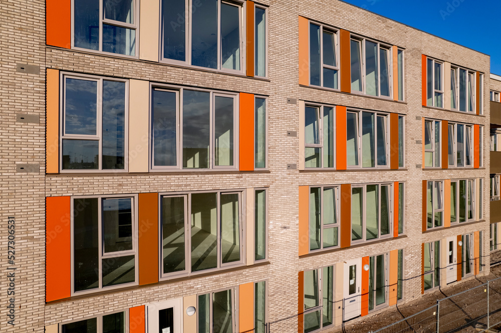 Final construction phase showing exterior facade aerial of real estate ...