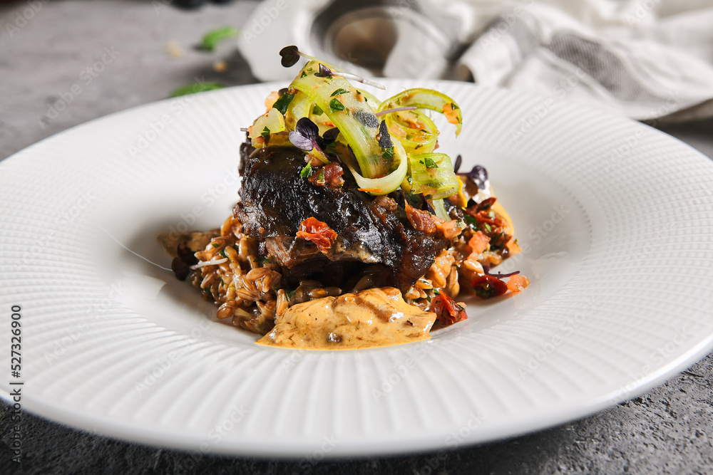 Braised beef cheeks with pearl barley and celery in creamy mushroom ...