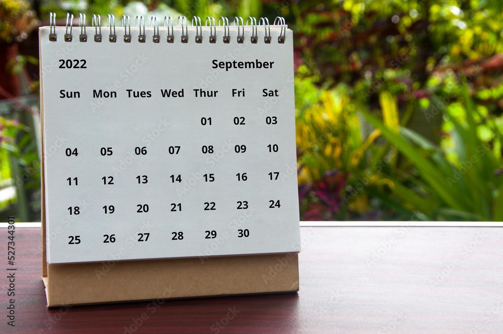 September 2022 white calendar with blurred nature background. Copy ...