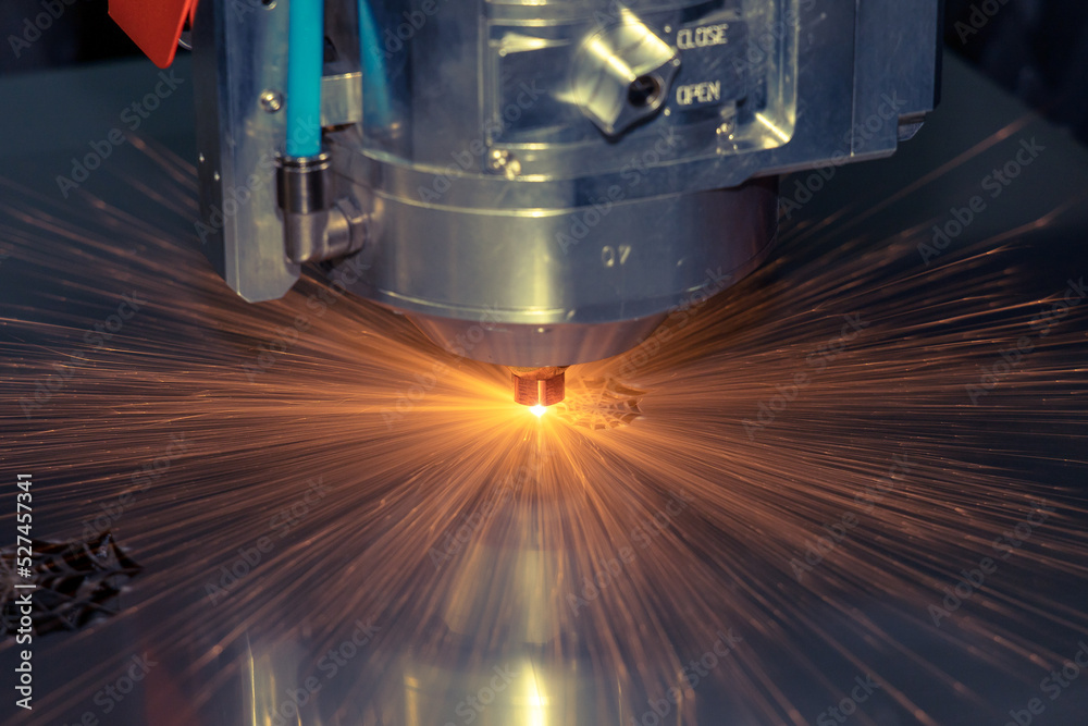 Laser cutting steel. Automatic laser cutting machine cuts shaped parts ...