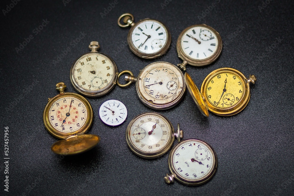 Vintage pocket watch and hour glass or sand timer, symbols of time with ...