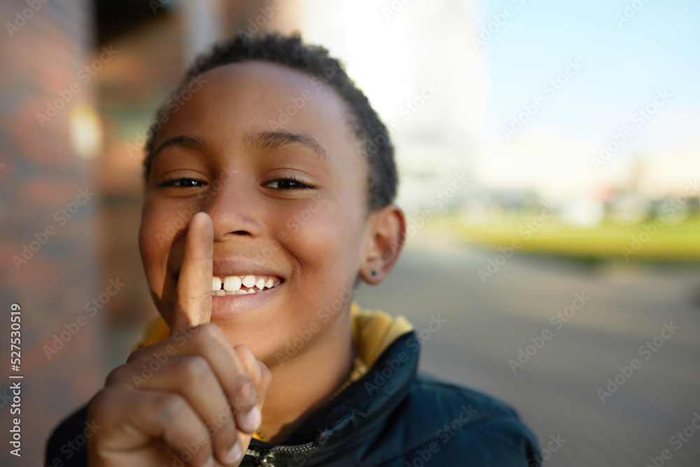 Funny african american kid boy playing with front camera taking selfie ...