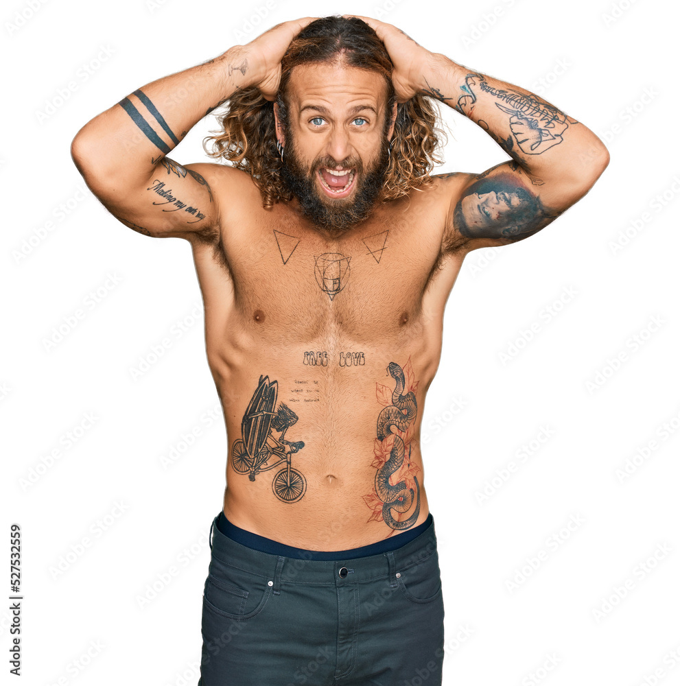 Handsome man with beard and long hair standing shirtless showing ...