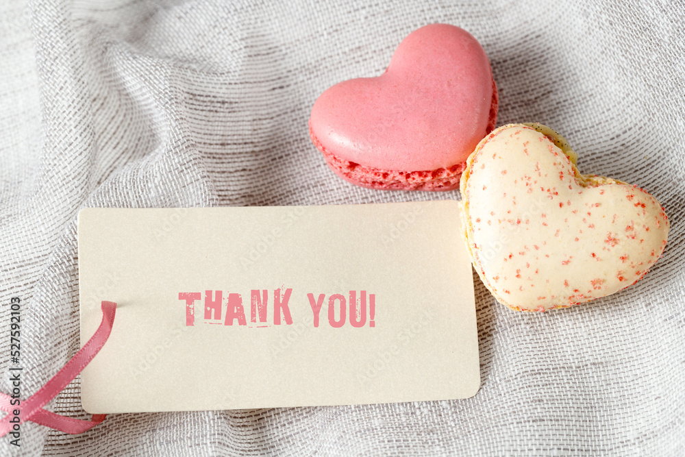 Thank you gift card with text and two macaroons in heart shape on light ...