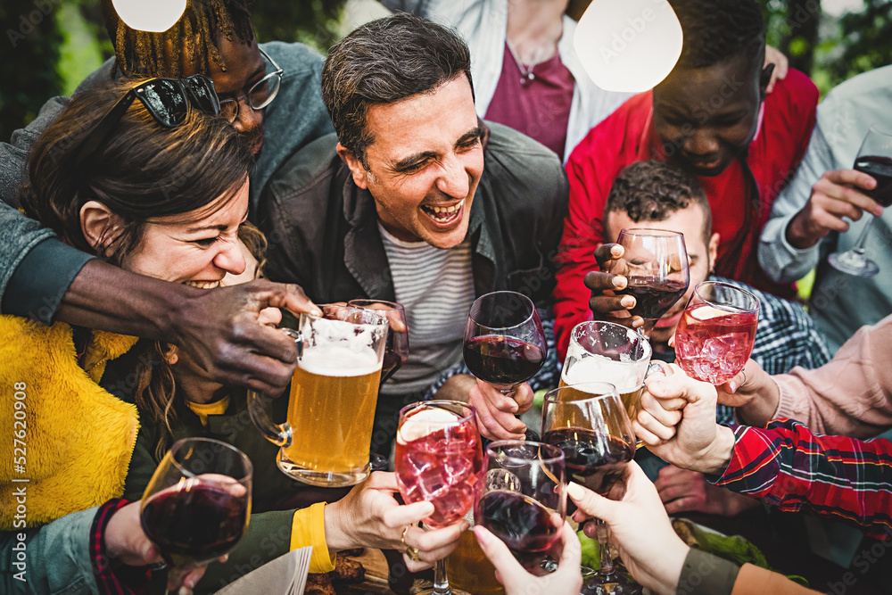 Group with many people celebrating a birthday toasting together with ...