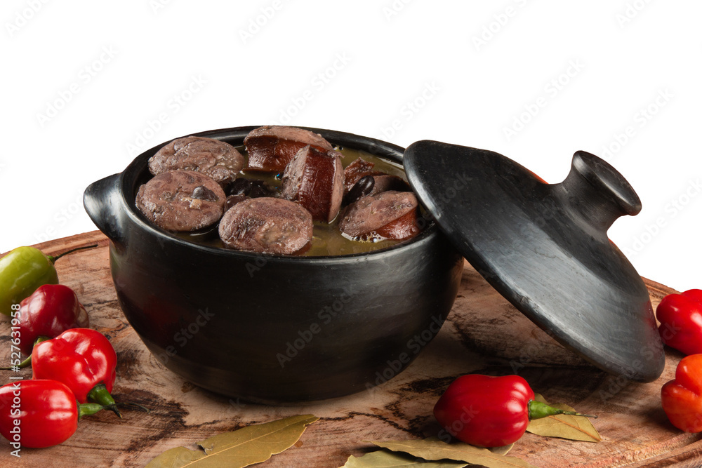 Feijoada. Traditional Brazilian food. Background with defocused fire ...