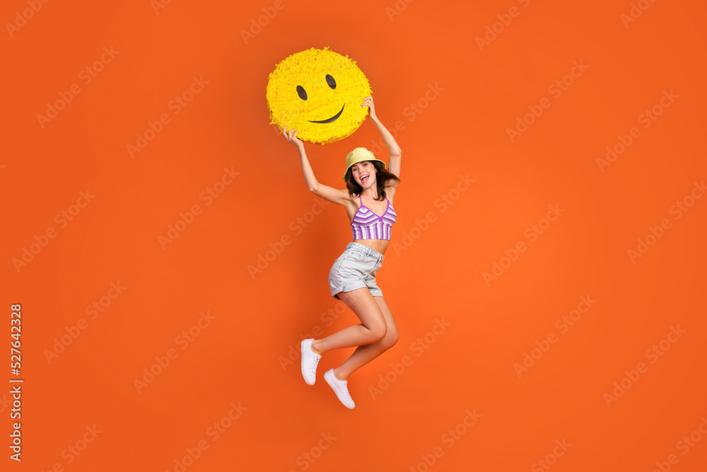 Full size photo of brunette impressed lady jump with pinata wear hat ...