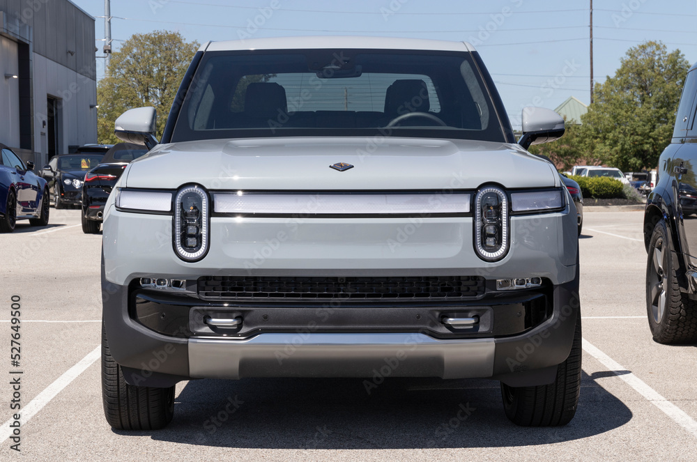 Rivian R1T Pickup Truck display at a dealership. Rivian offers the R1T ...