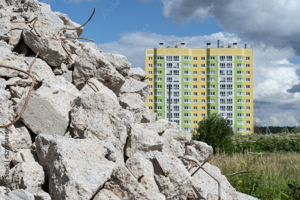 The slope of a pile of gray concrete debris from the dismantling of a ...