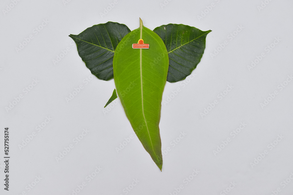 handmade leaf ganpati on white background, vinayagar chaturthi special. Stock Photo | Adobe Stock