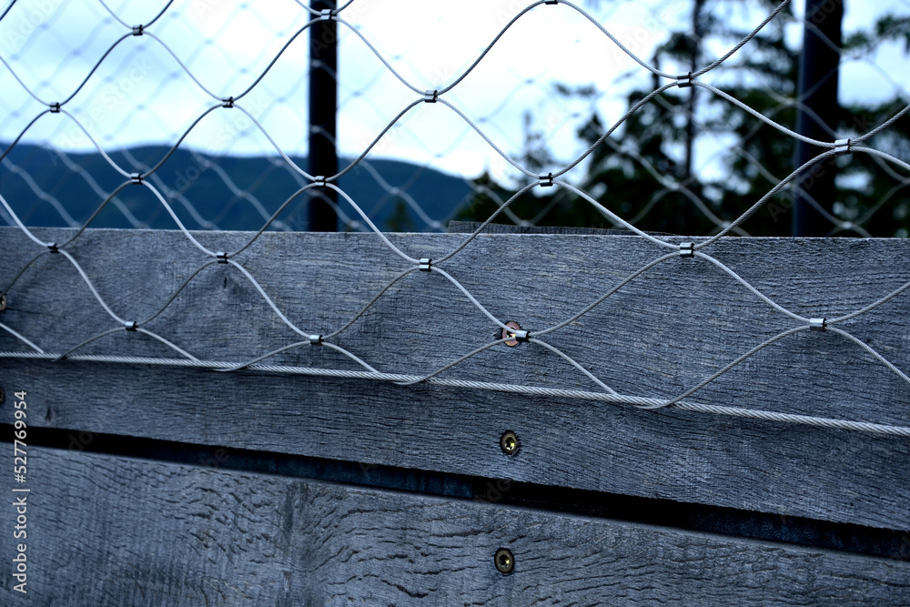 Terrace fencing, railings of metal pipes filled with steel cables cable ...