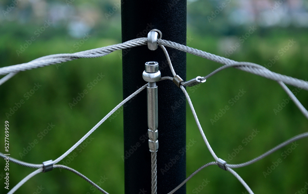 Terrace fencing, railings of metal pipes filled with steel cables cable ...
