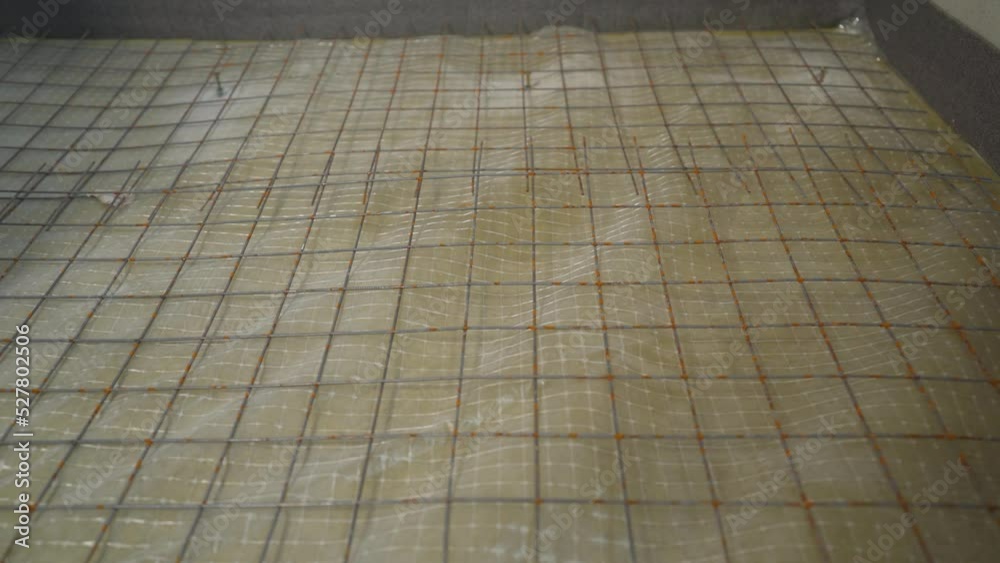 The process of soundproofing the floor, reinforcing mesh before pouring ...