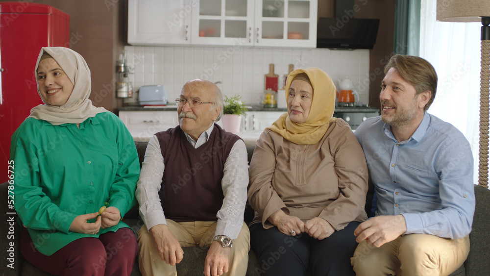 A Muslim Turkish family visits their living room for Eid. Eid Mubarak ...