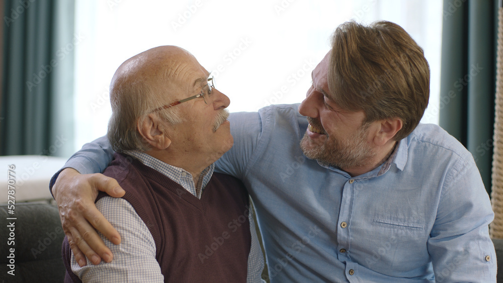 The young man is happy to see his father come to visit. The old man and ...