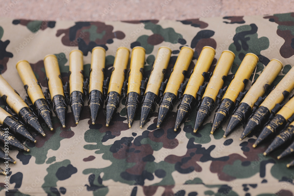 Details with 20mm ammunition for a military helicopter gun. Stock Photo ...