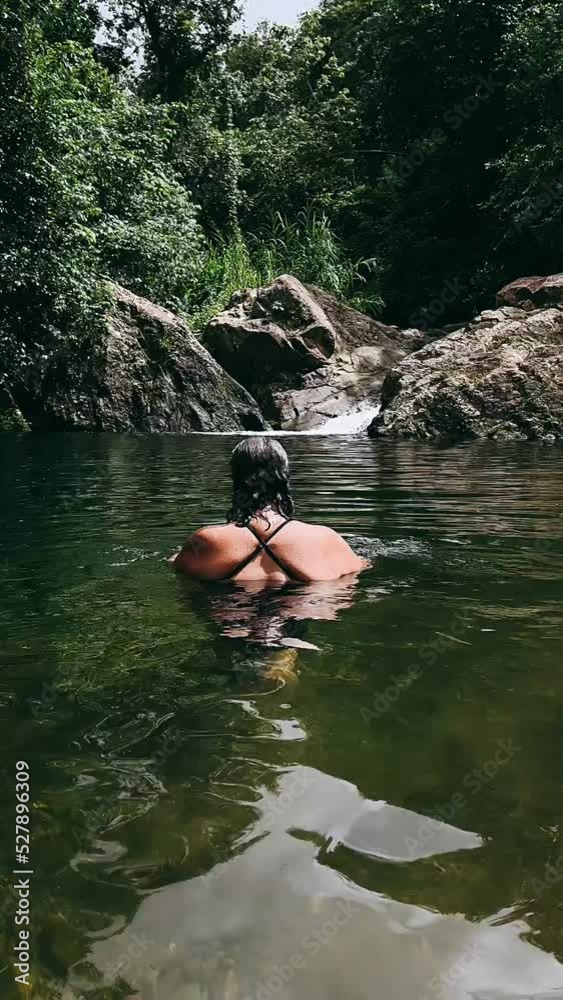 person in the river, woman in the river, woman by waterfall,Woman ...