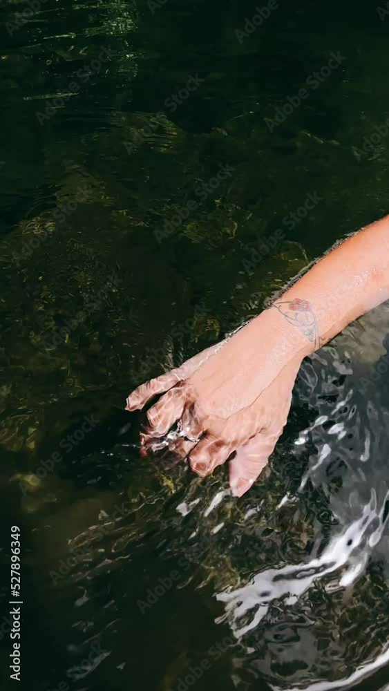 Woman running hands in water, hand in water, relaxing hands, nature ...